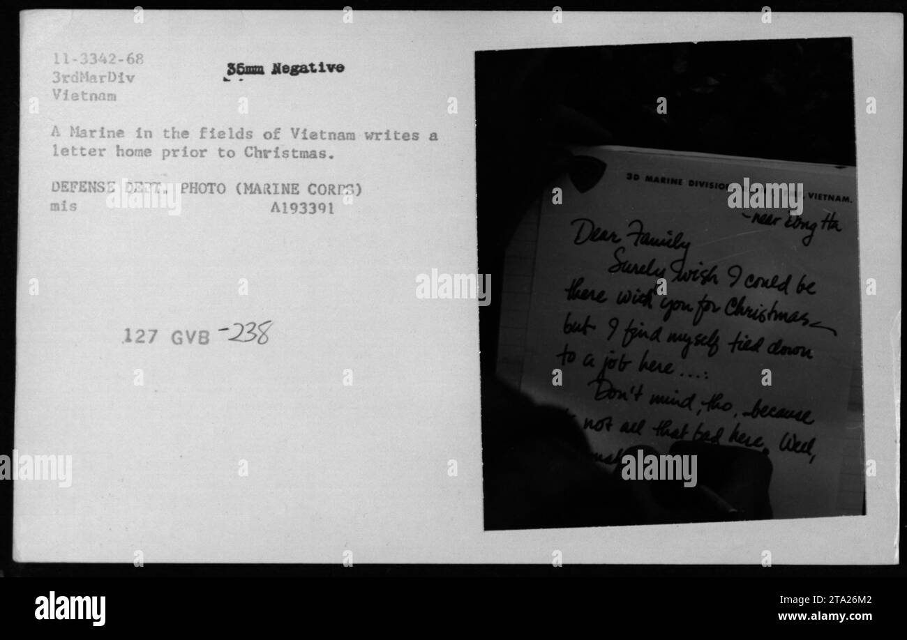 A Marine stationed in Vietnam takes a moment to write a letter home ...