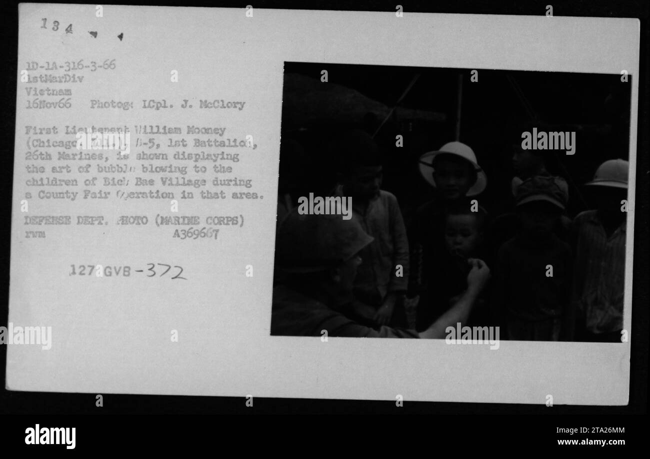 First Lieutenant 1/111iam Mooney, from Chicago, Illinois, demonstrates ...