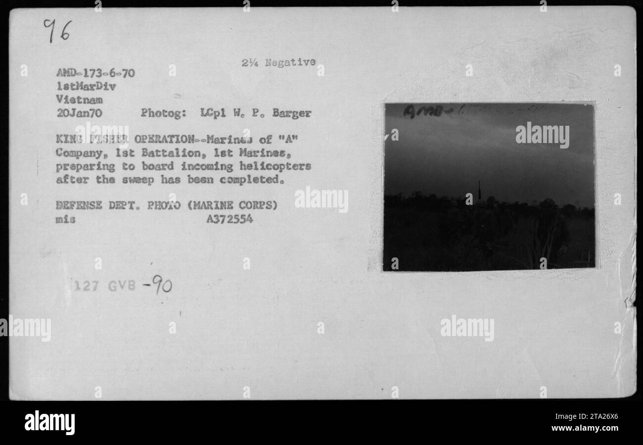 Marines of "A" Company, 1st Battalion, 1st Marines, preparing to board helicopters after ...