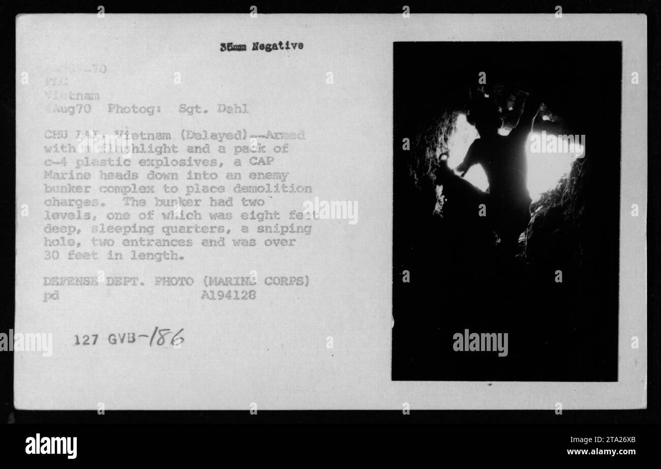 A CAP Marine enters an enemy bunker complex armed with a flashlight and ...