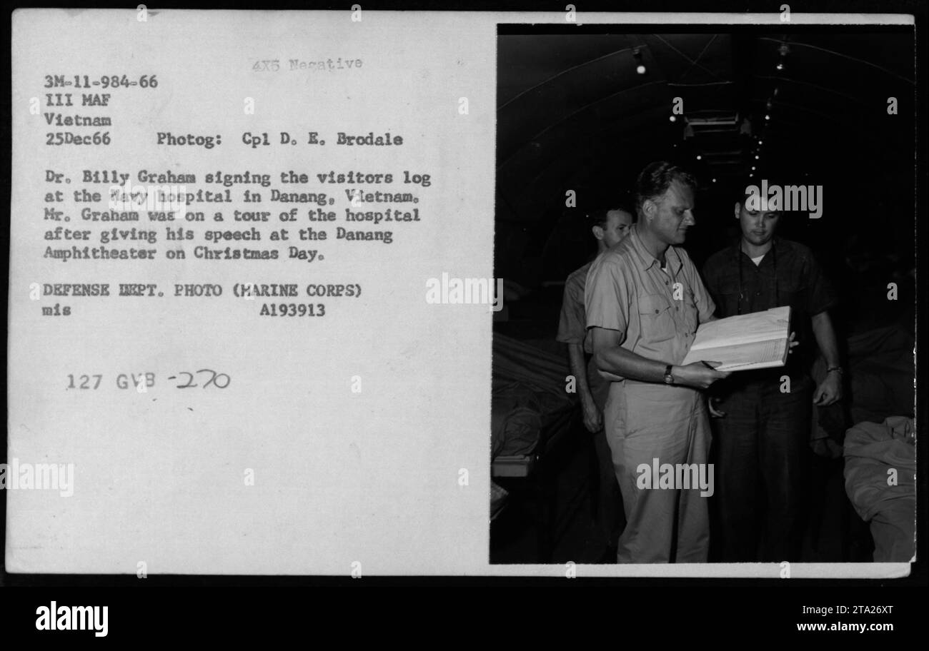 On December 25, 1966, Dr. Billy Graham signs the visitors log at the ...