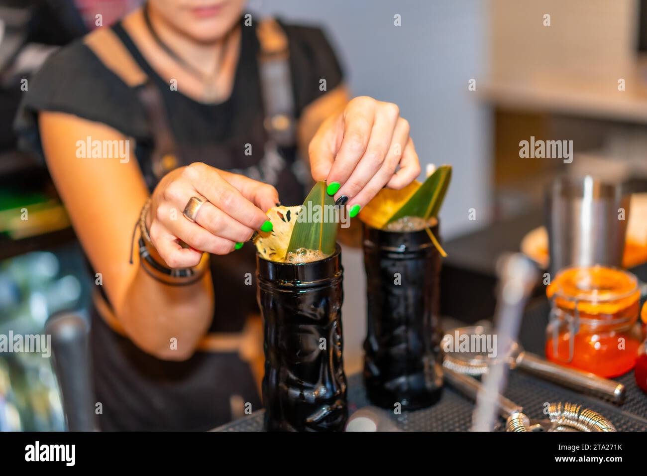 Bartender garnishing cocktails hi-res stock photography and images - Alamy
