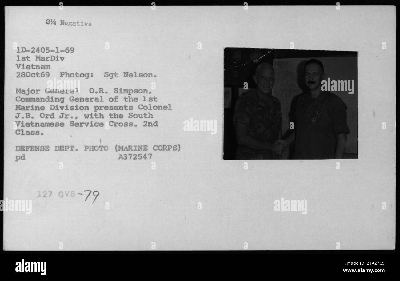 Major General O.R. Simpson presents Colonel J.B. Ord Jr. with the South ...