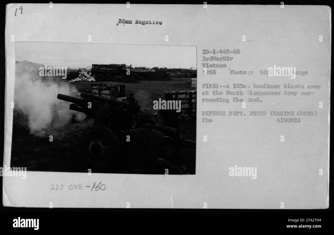 A Marine operating a 105 howitzer fires at the surrounding North ...