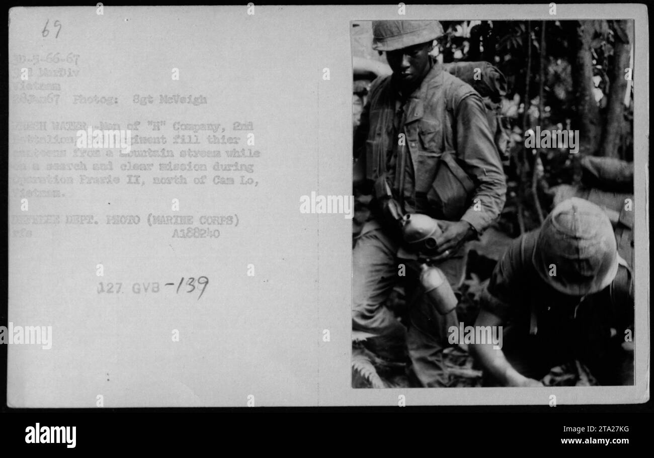 Soldiers from "H" Company, 2nd Battalion, 3rd Regiment, fill their ...