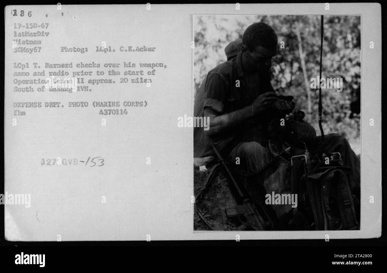 LCpl T. Barnerd, a marine from the 1stMarDiv, is shown checking his ...