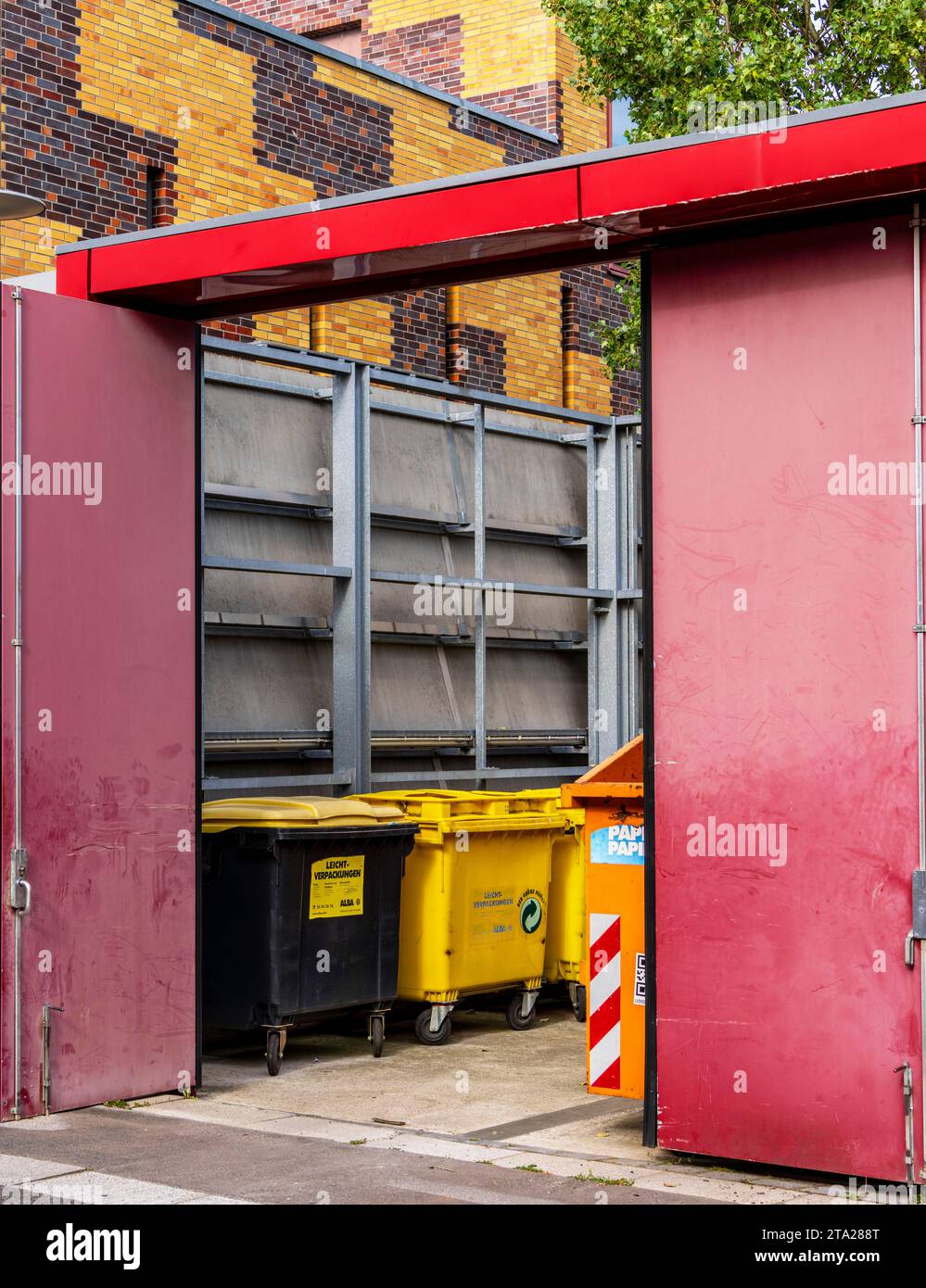Waste bins, locked waste room, Berlin, Germany Stock Photo - Alamy
