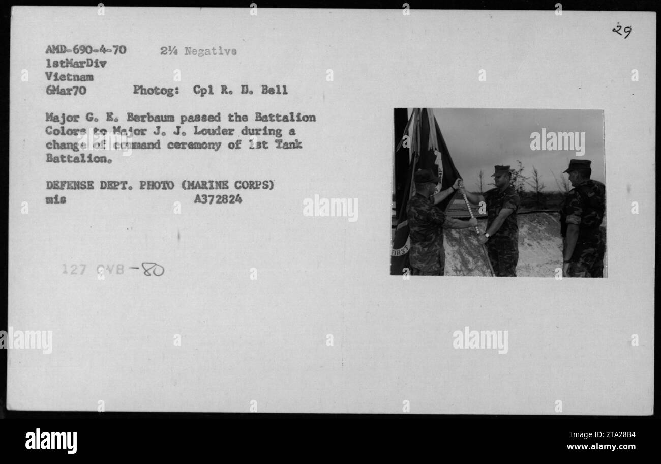 Major G. E. Berbaum passes the Battalion Colors to Major J. J. Louder ...