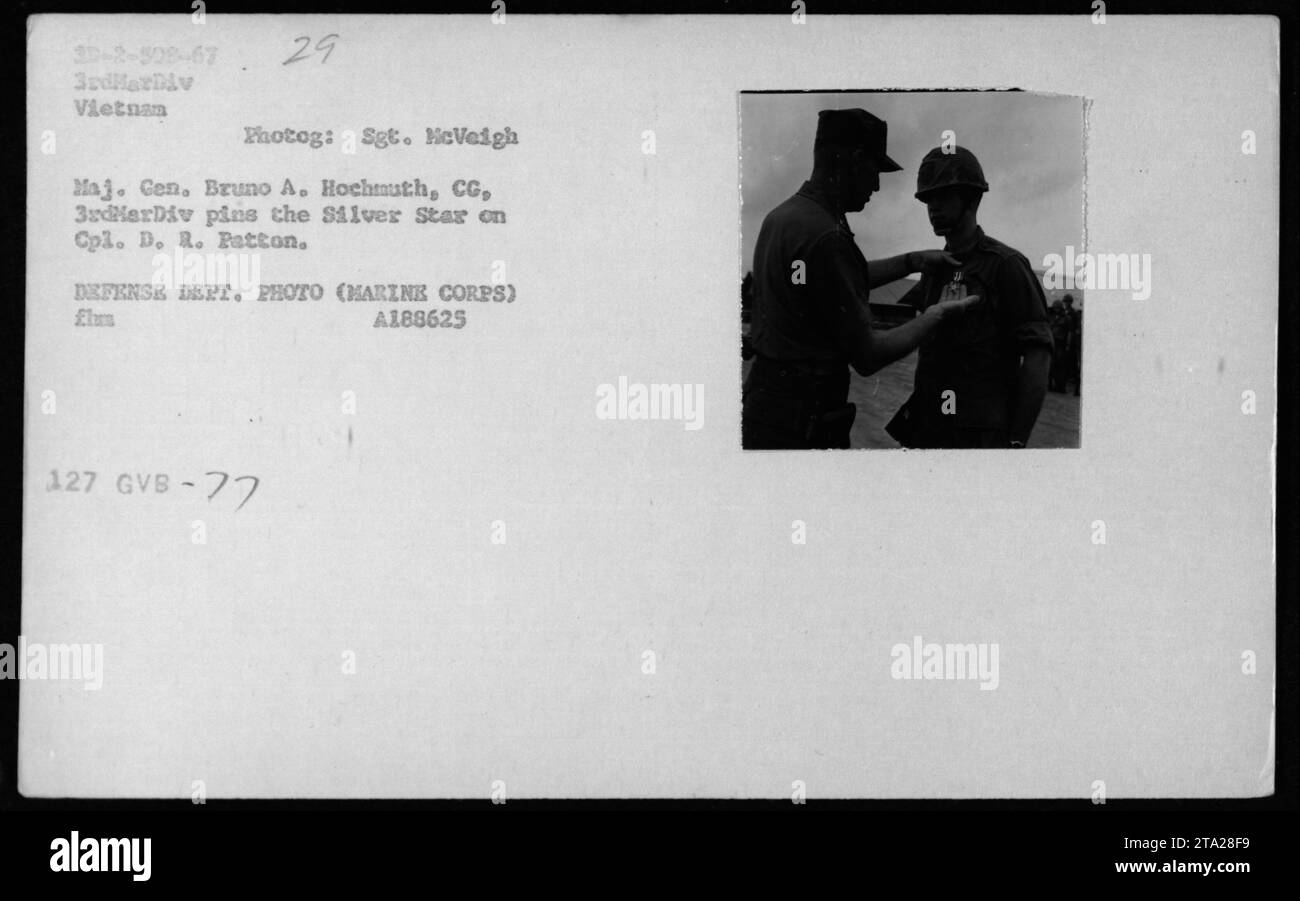 Maj. Gen. Hochmuth of the 3rd Marine Division in Vietnam awards Cpl. D ...