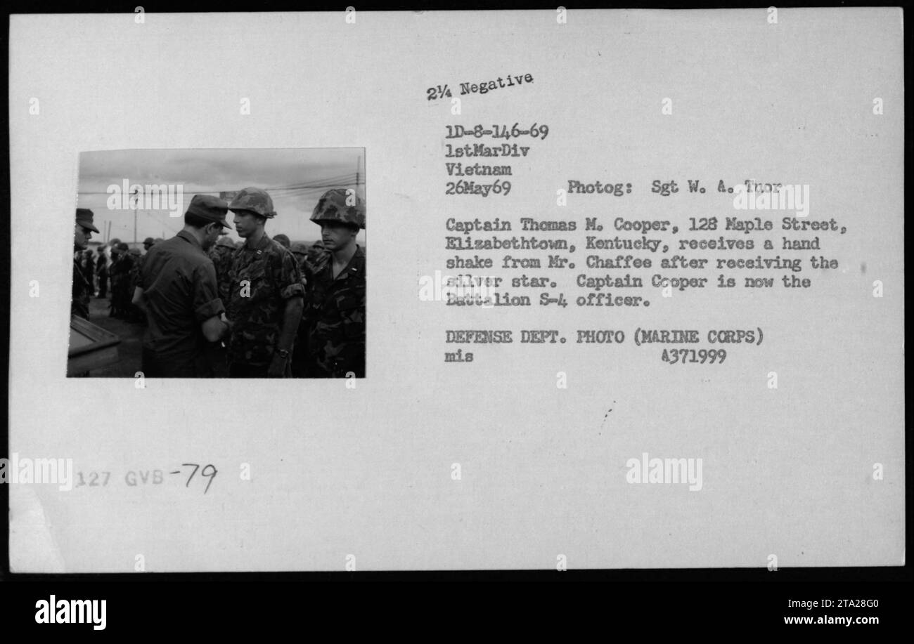 Captain Thomas M. Cooper received the Silver Star and a handshake from ...