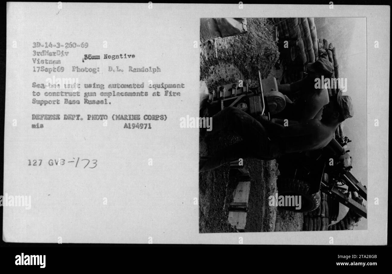 Sea-bee unit using automated equipment to construct gun emplacements at ...