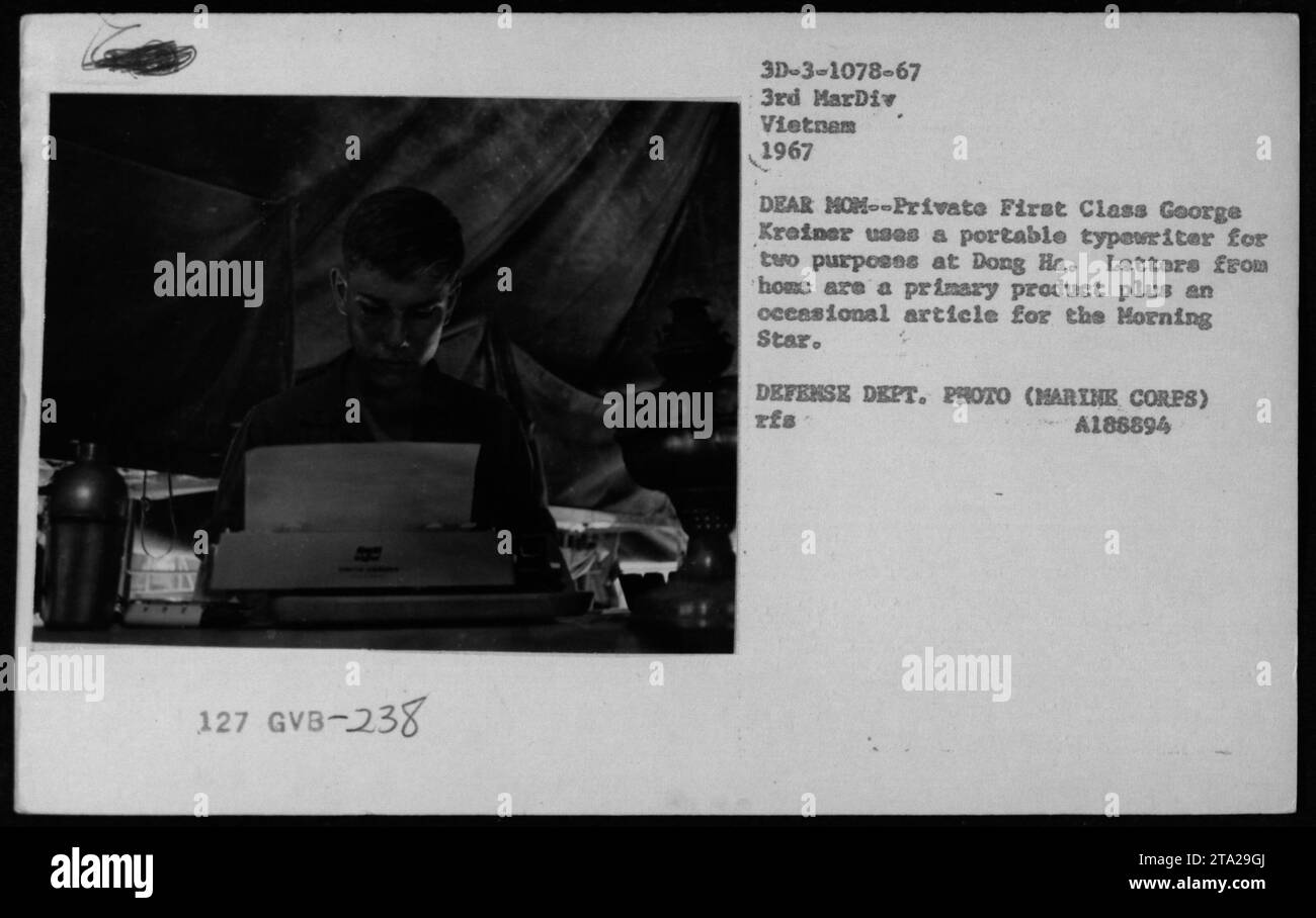 Private First Class George Kreiner using a portable typewriter for ...