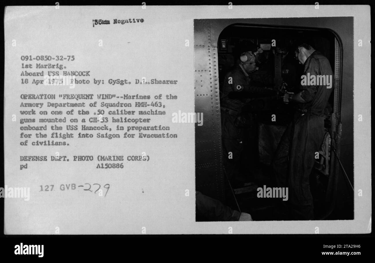 "Marines of the Armory Department of Squadron HMH-463 work on a .50 ...