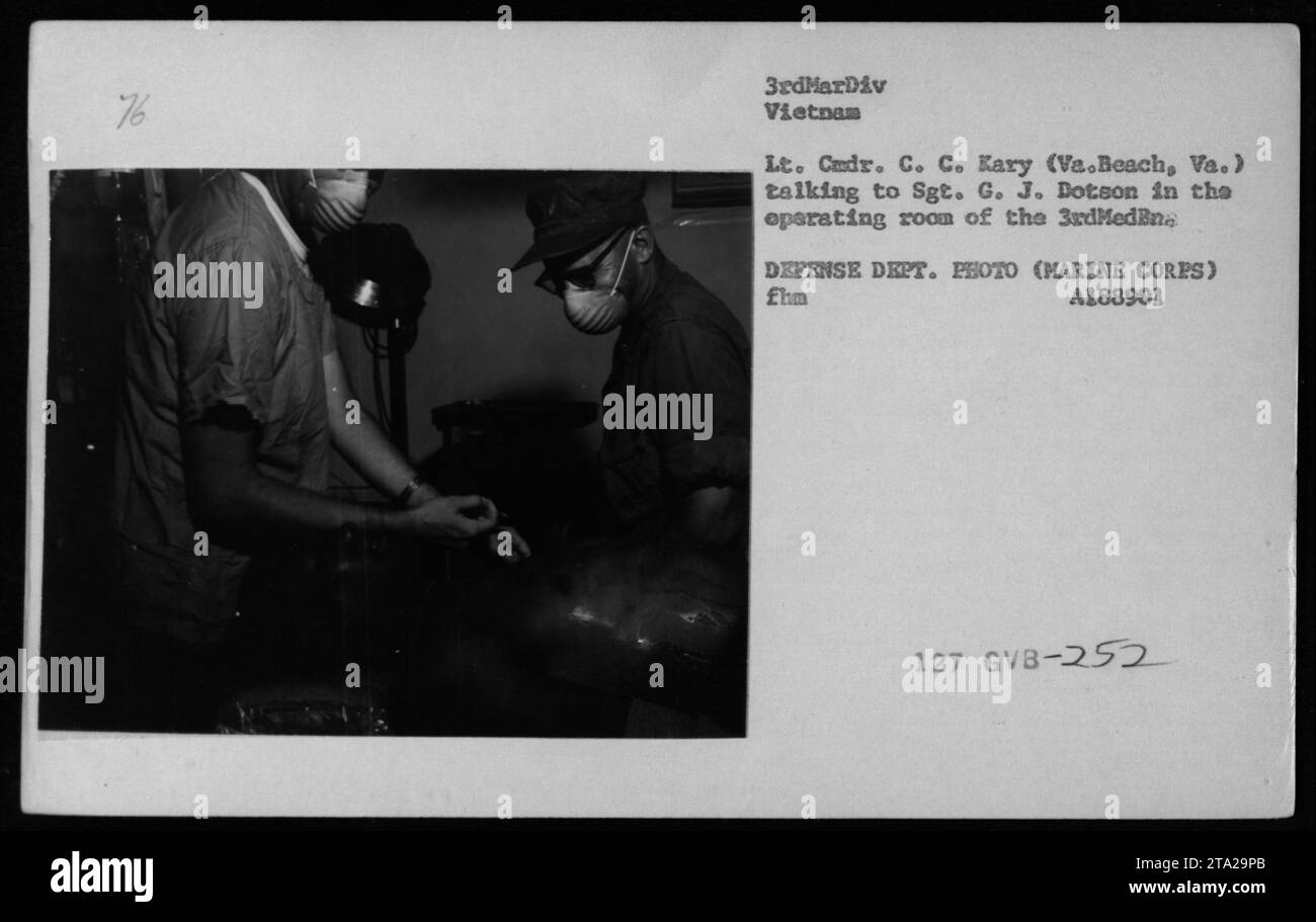 Lt. Cmdr. C. C. Kary from Virginia Beach, Virginia, is seen conversing ...