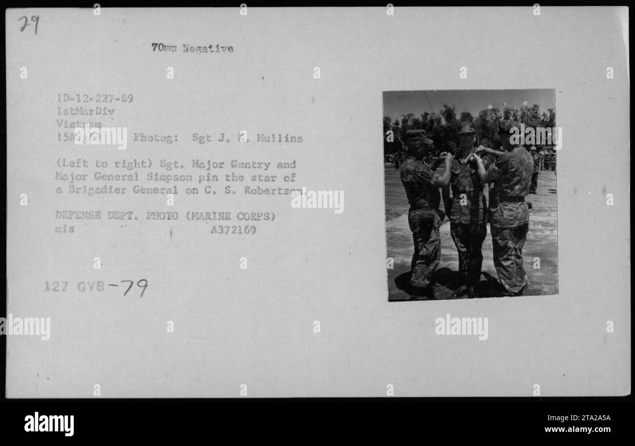 Sgt. Major Gentry and Major General Simpson pin the star of Brigadier ...