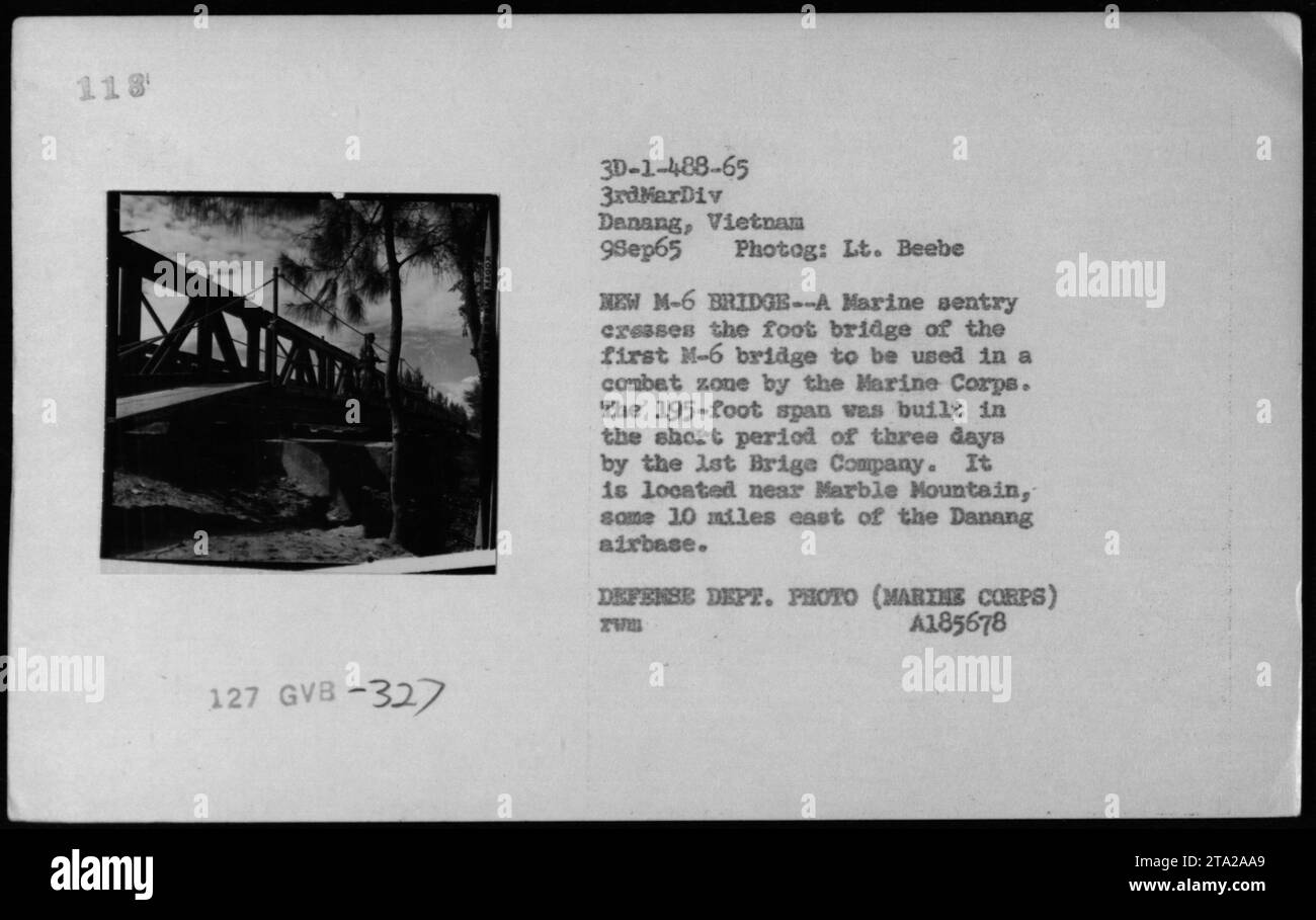 A Marine sentry crosses the 195-foot M-6 bridge near Marble Mountain ...