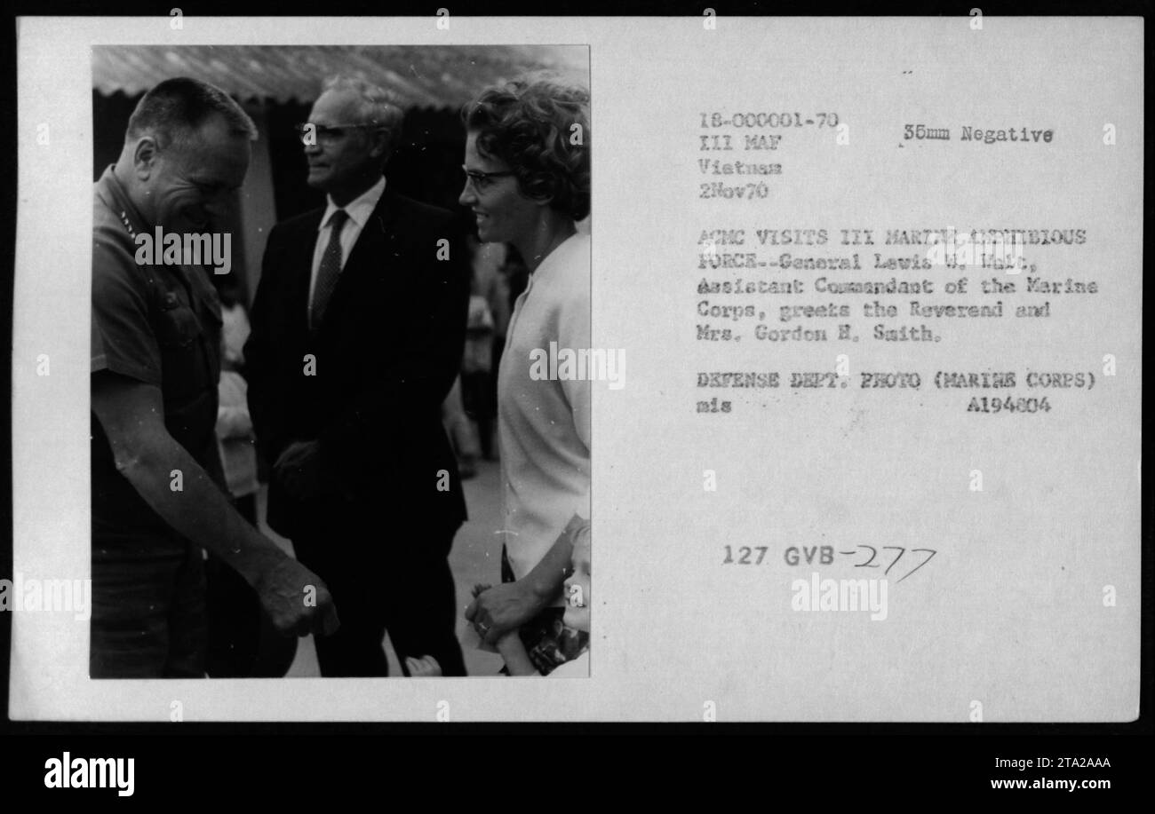 Lt Gen Lewis W. Walt greets Reverend and Mrs. Gordon B. Saith during a ...