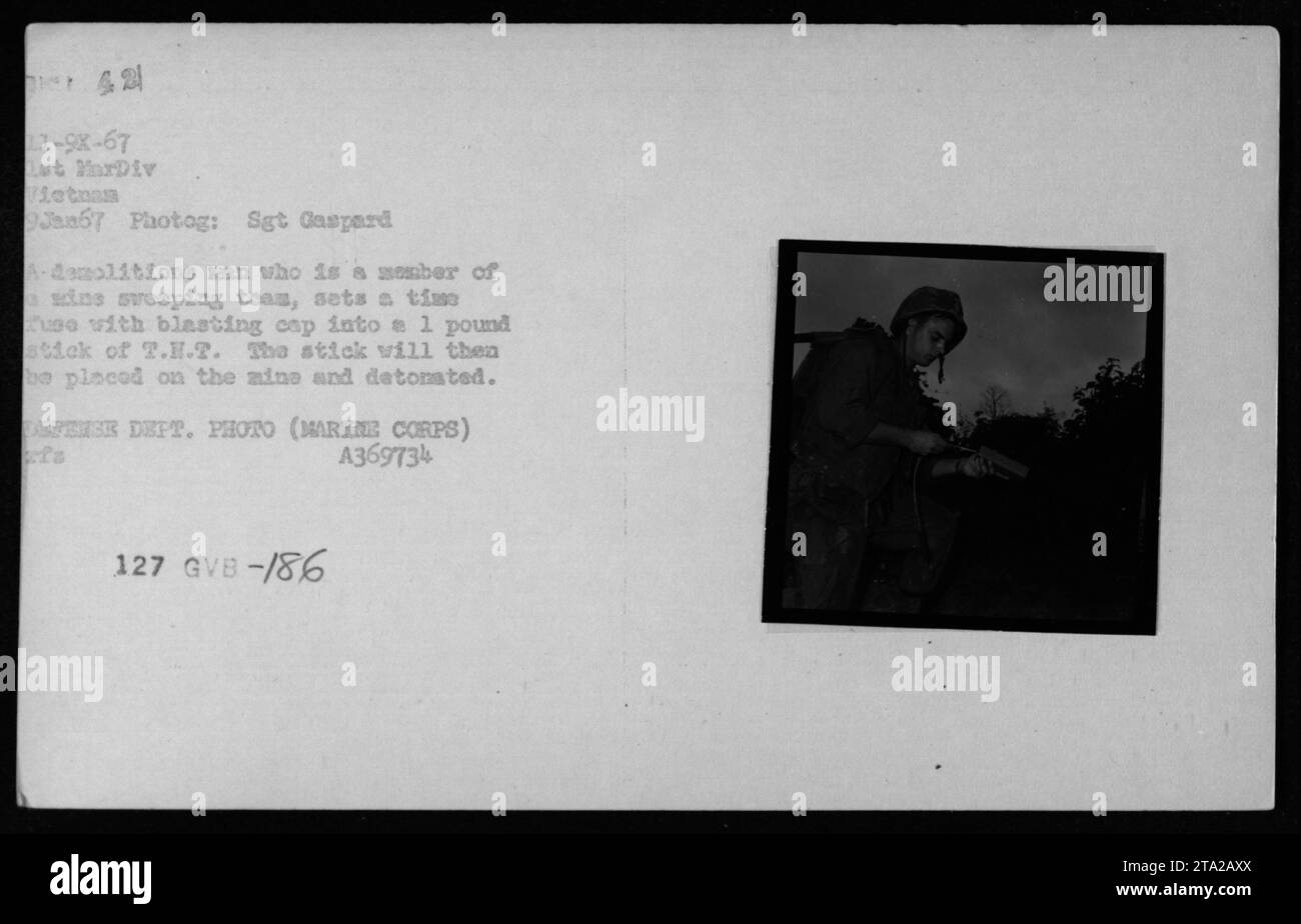 A Marine Corps demolition expert prepares to detonate a mine using a 1 ...