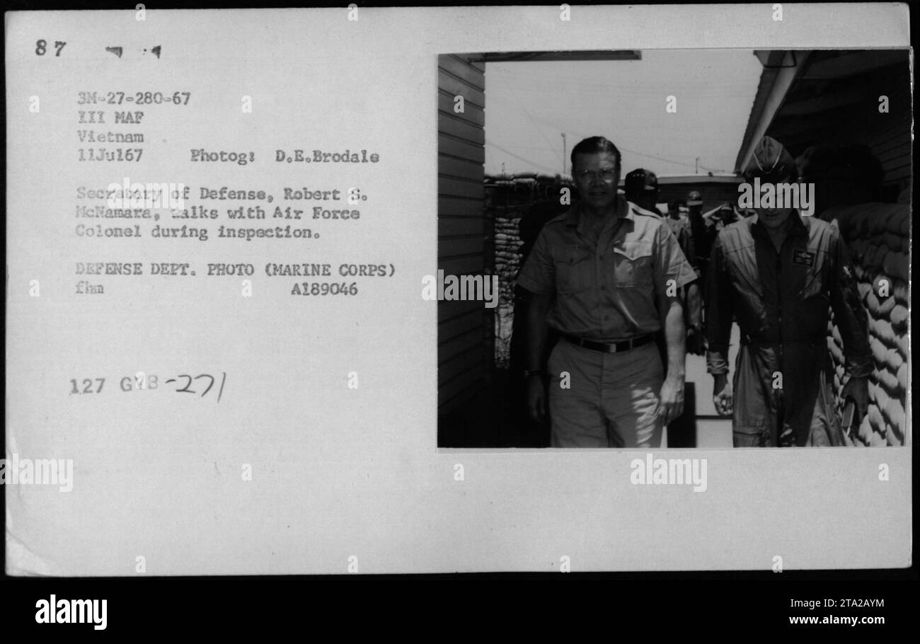 "Secretary of Defense, Robert S. McNamara, seen conducting an ...