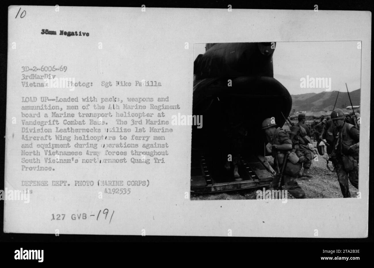 Men of the 4th Marine Regiment board a Marine transport helicopter at ...