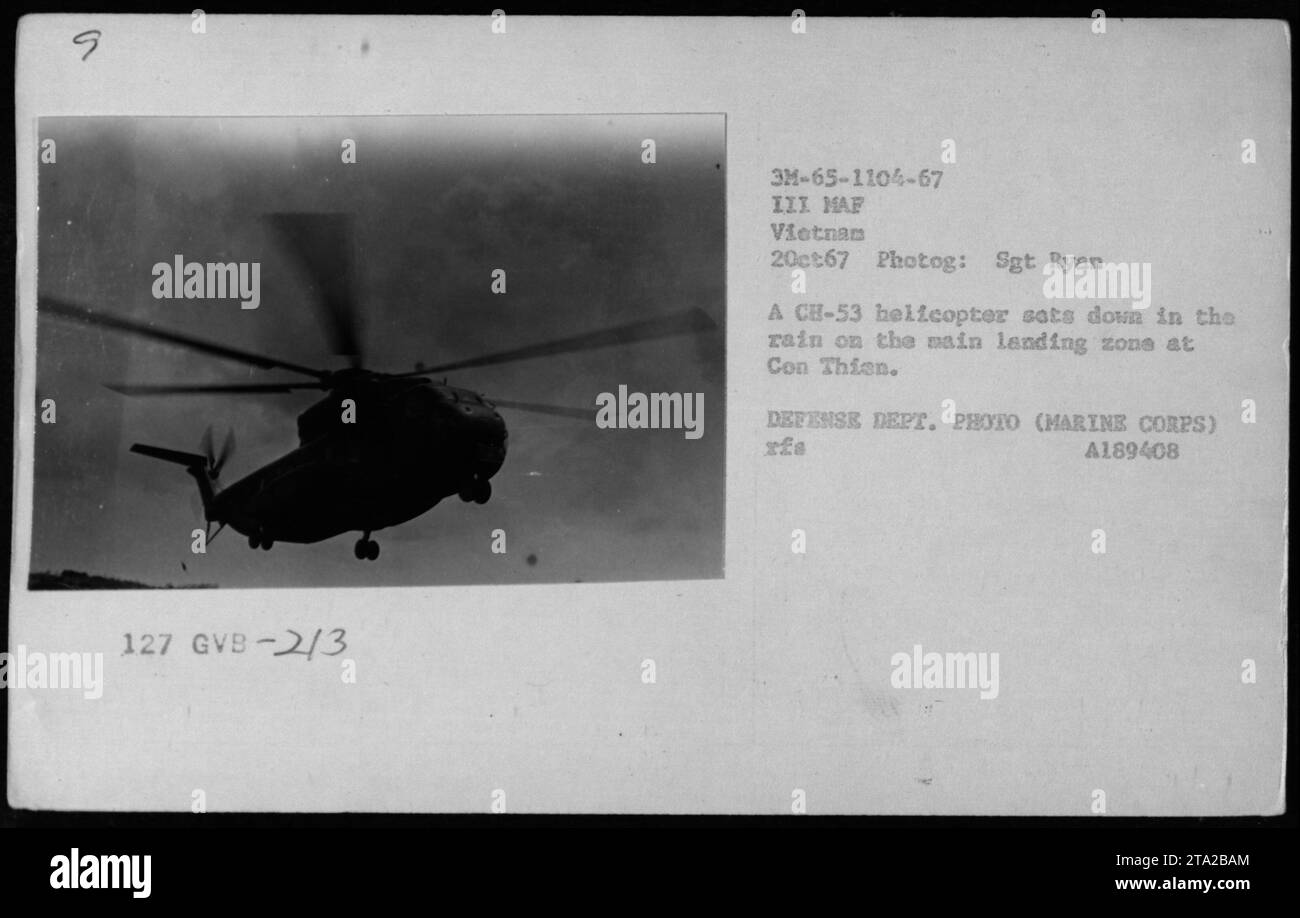 A CH-53 helicopter lands during a heavy rain on the primary landing ...