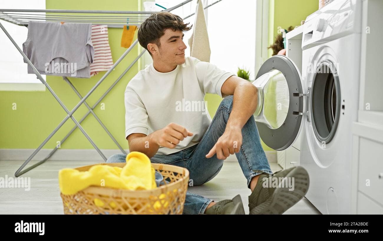 Confident young hispanic teenager smiling joyfully as he tackles ...