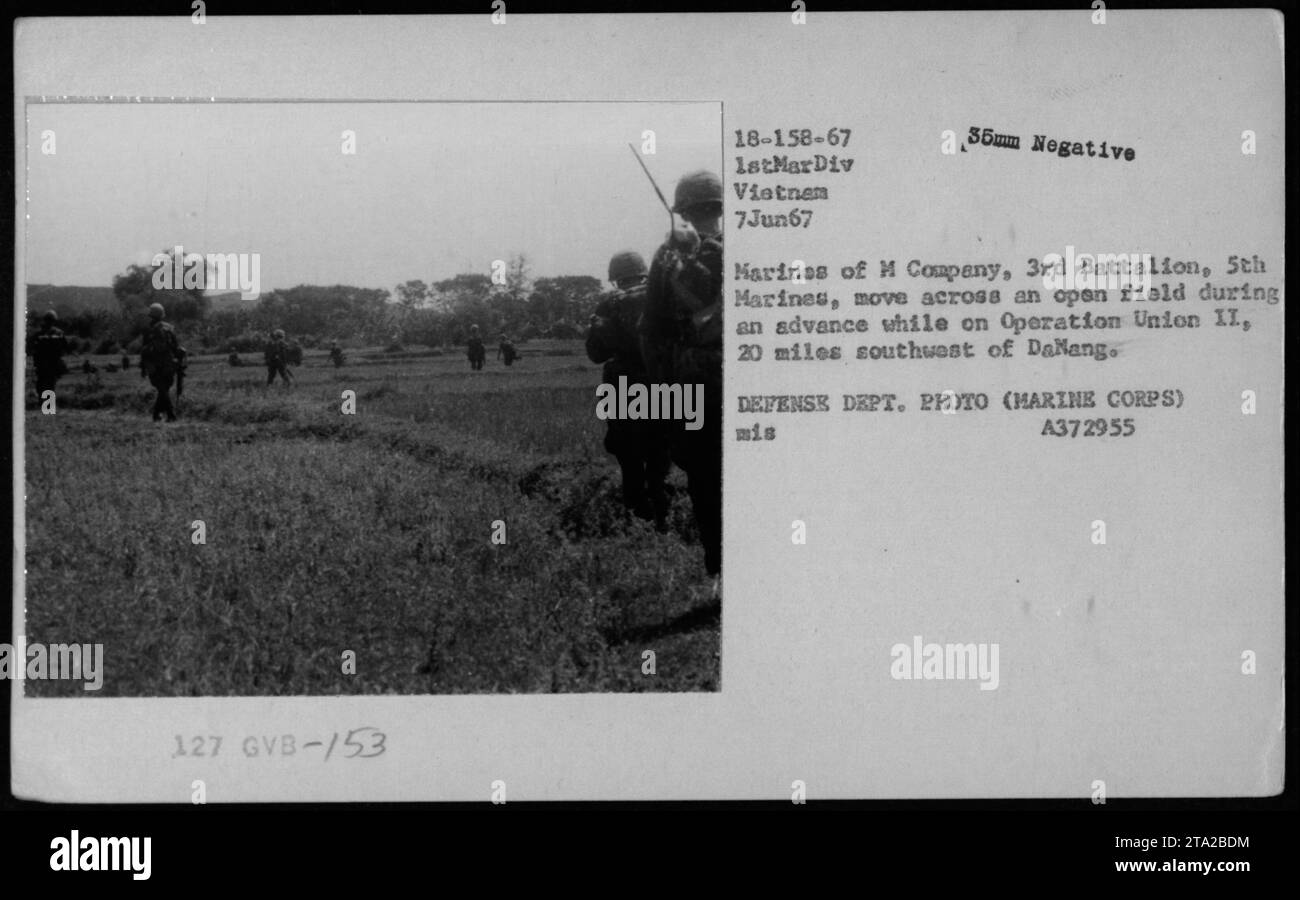 Marines of M Company, 3rd Battalion, 5th Marines, are seen advancing ...