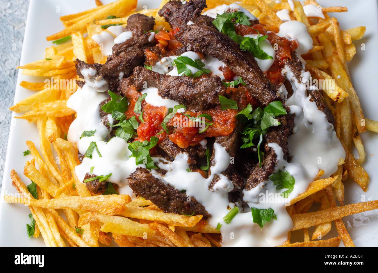 Turkish food; Cokertme Kebab - Beef meat kebab with yoghurt and french ...