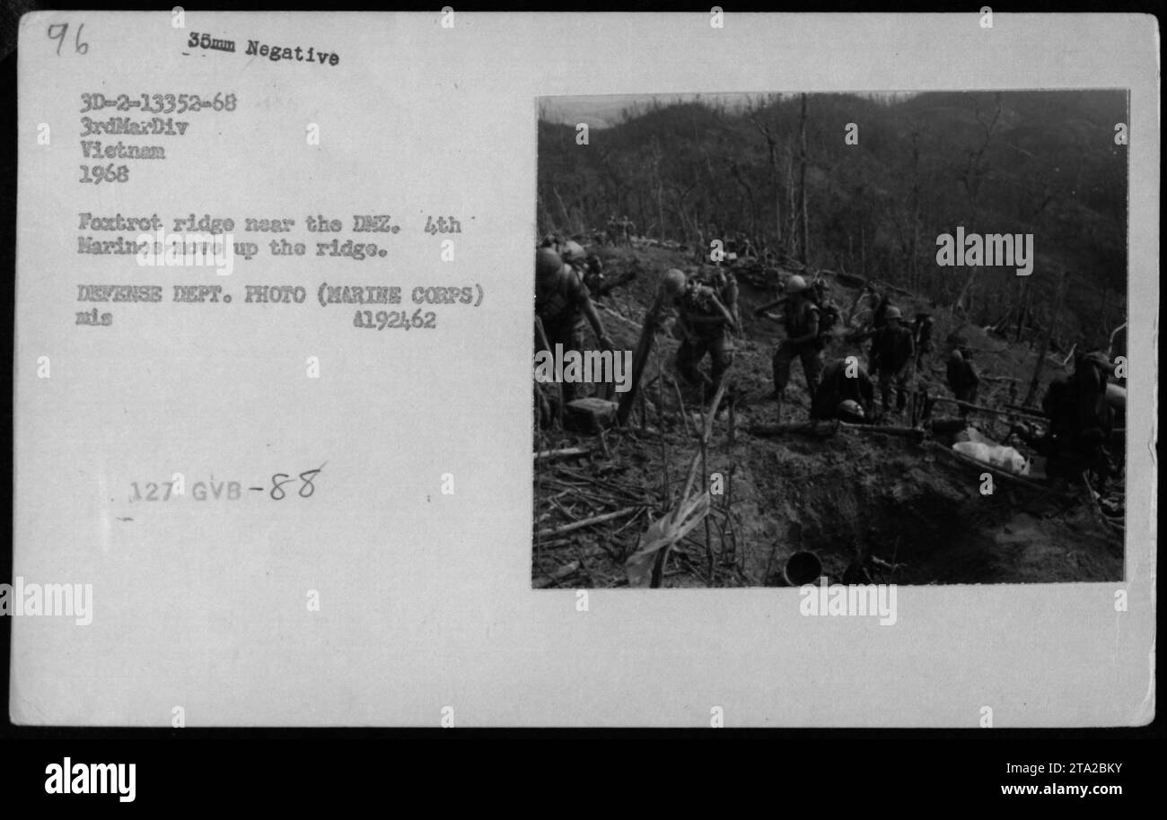 US Marines from the 4th Division advance up Foxtrot Ridge near the DMZ ...