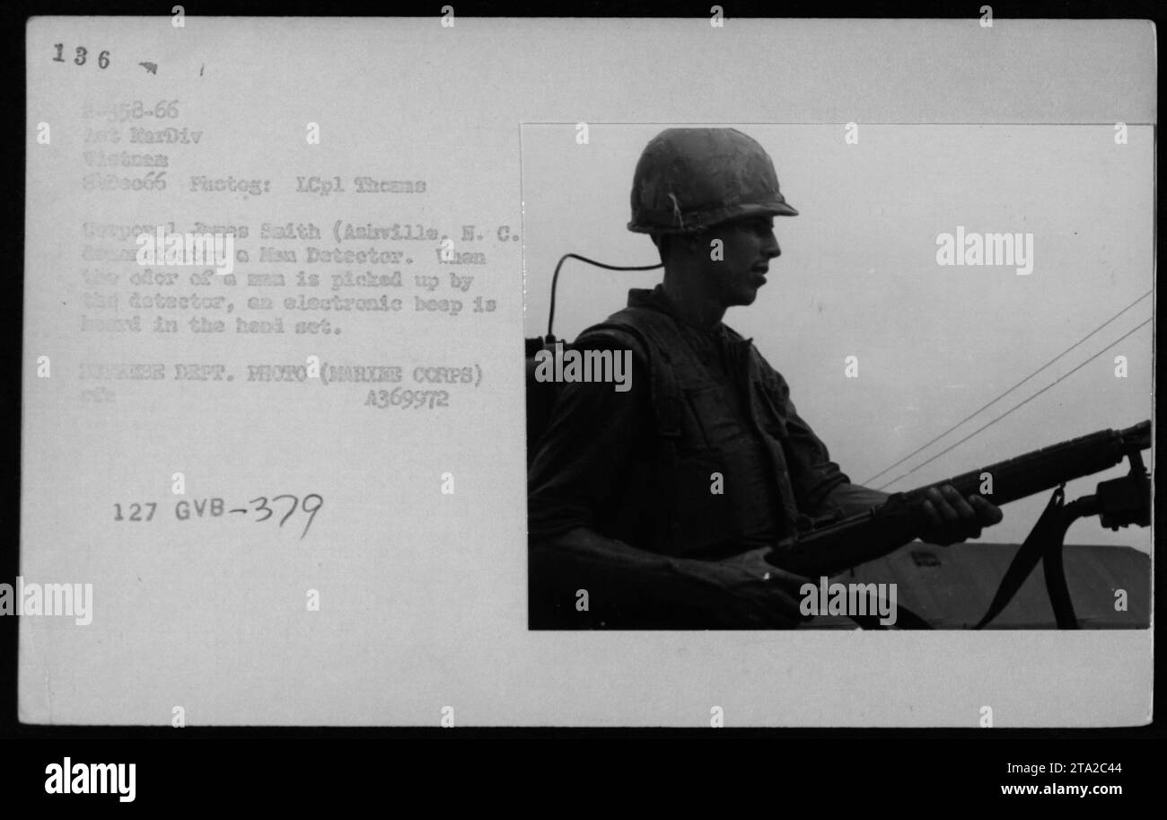 A U.S. Marine, LCpl Thomas, uses an ASIVille line mine detector to ...