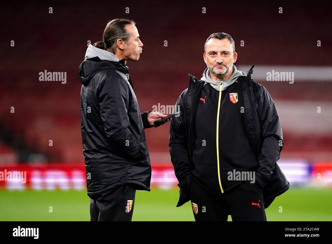 RC Lens head coach Franck Haise (right) and assistant manger Lilian ...