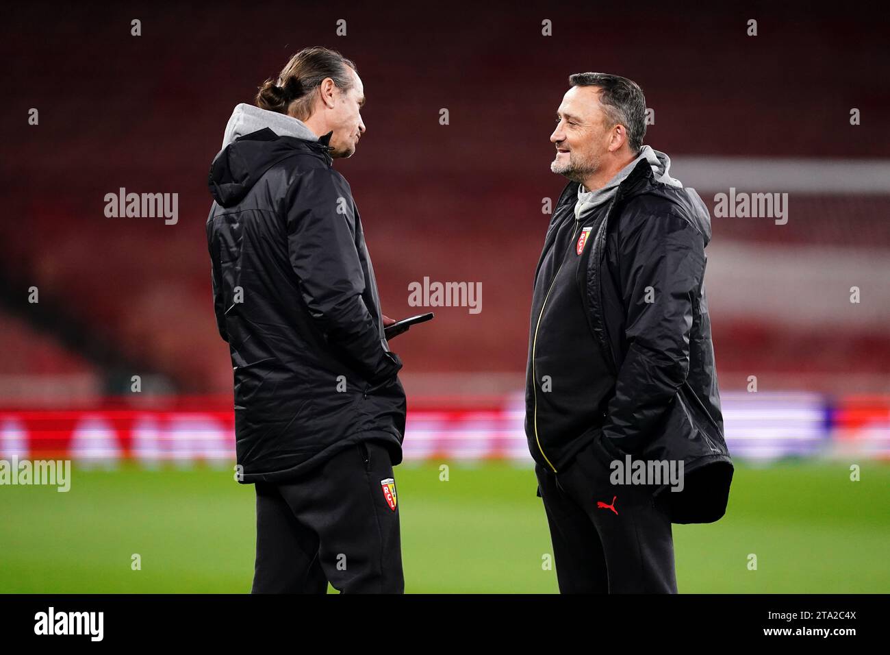 RC Lens head coach Franck Haise (right) and assistant manger Lilian ...