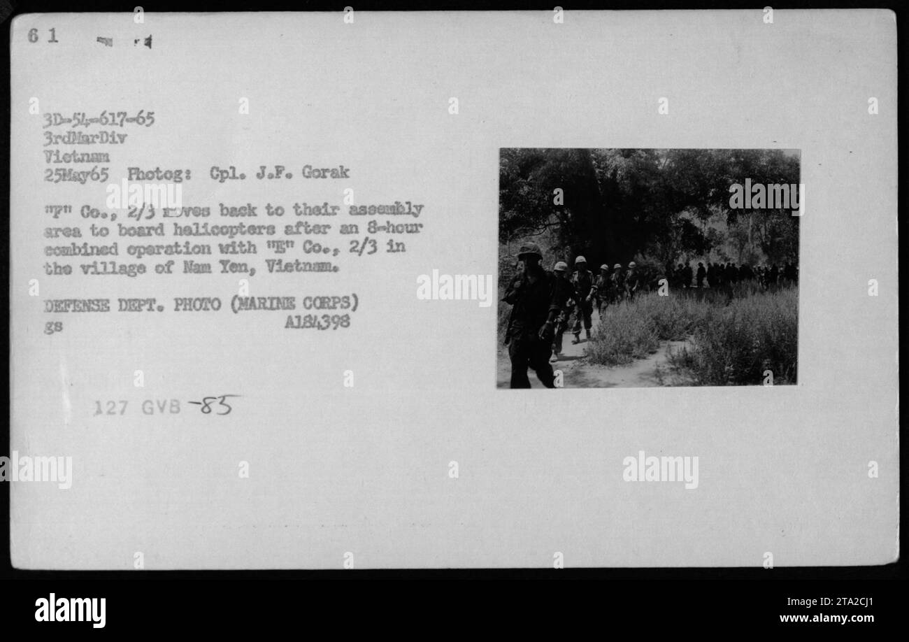 Marines from 2nd Battalion, 3rd Marine Division load helicopters after ...