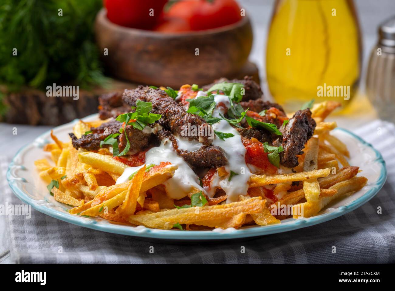 Turkish food; Cokertme Kebab - Beef meat kebab with yoghurt and french ...