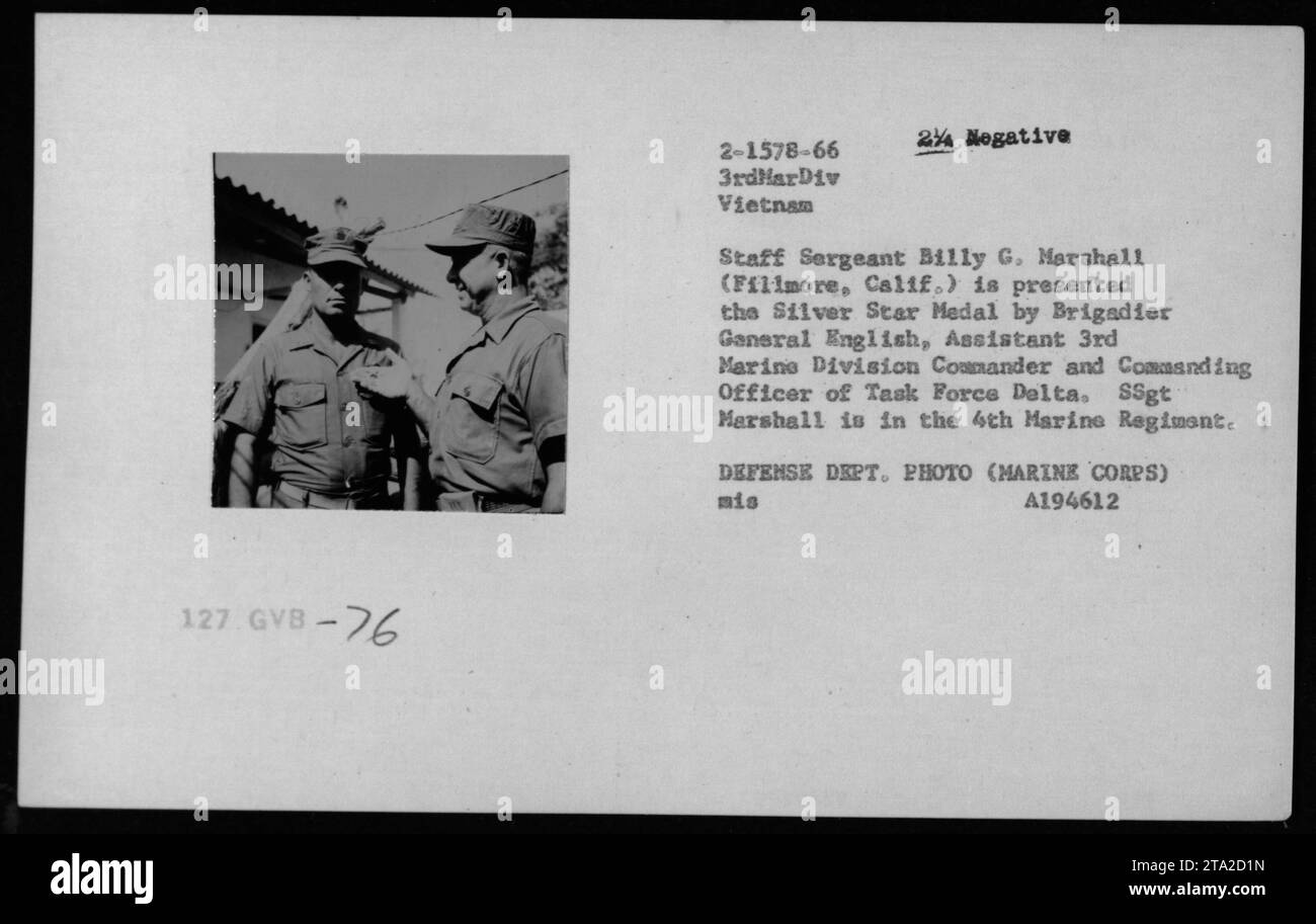 Staff Sergeant Billy G. Marshall of the 4th Marine Regiment receives ...