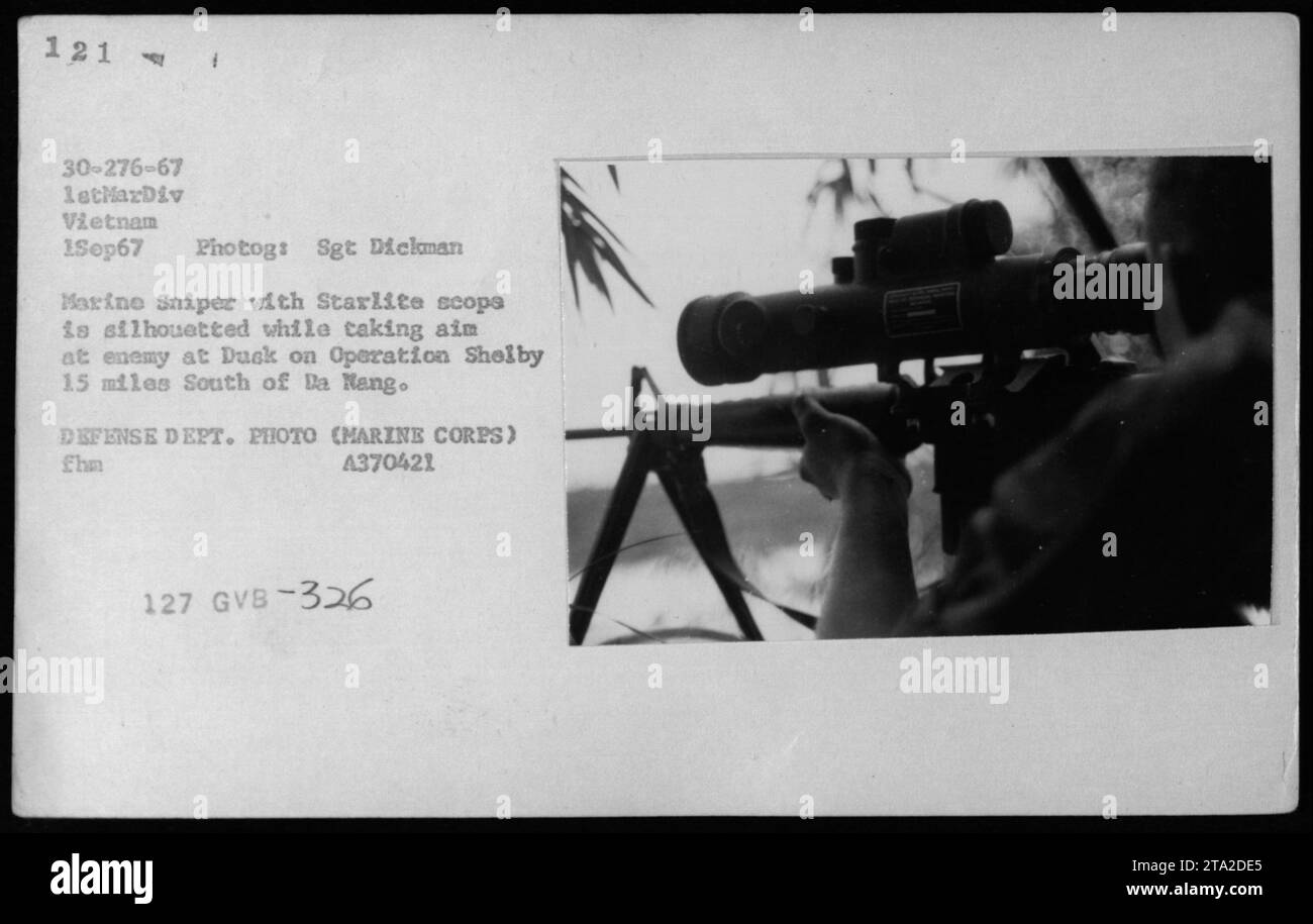 A Marine sniper equipped with a Starlite scope takes aim during ...