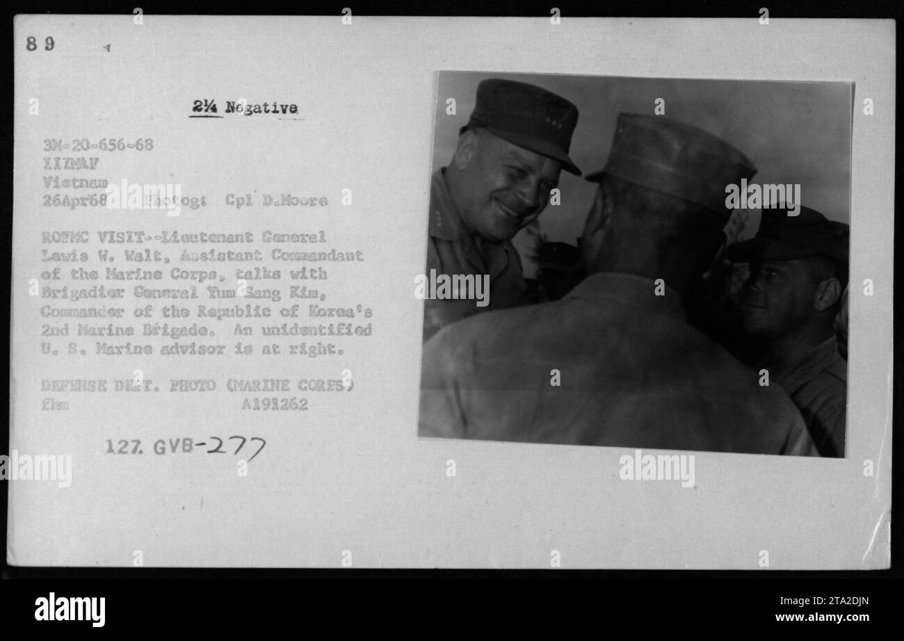 Lt Gen Lewis W. Walt discusses with Brig Gen Yum Sang Kim, commander of ...