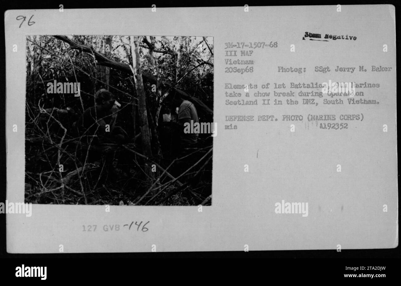 Members of the 1st Battalion, 9th Marines are resting and eating during ...