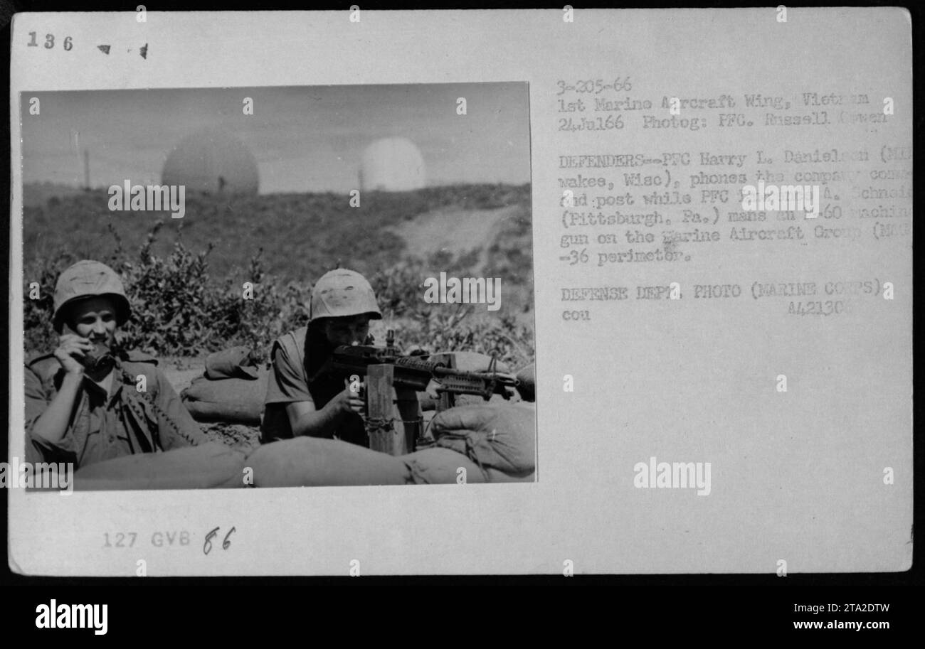 PFC Harry L. Daniel calls for reinforcement while PFC Lawrence A ...