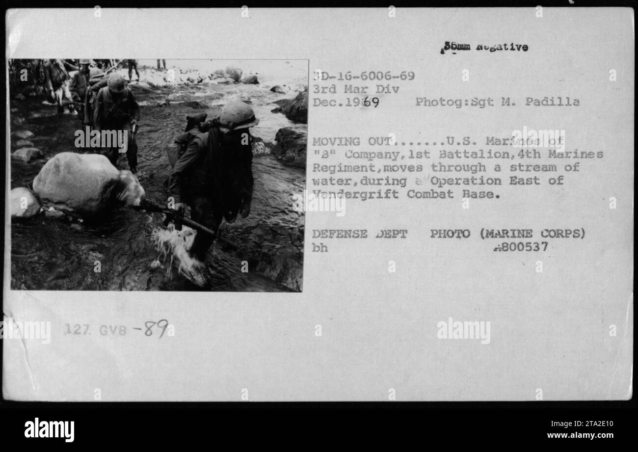 U.S. Marines from 3rd Company, 1st Battalion, 4th Marines cross a water ...