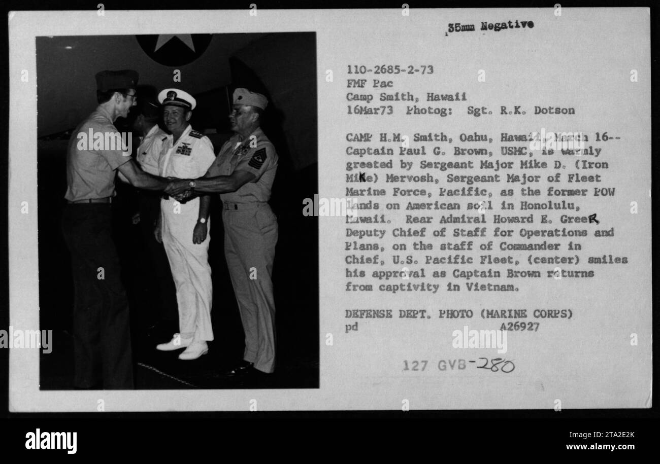 Captain Paul G. Brown, a former POW, is greeted by Sergeant Major Mike ...
