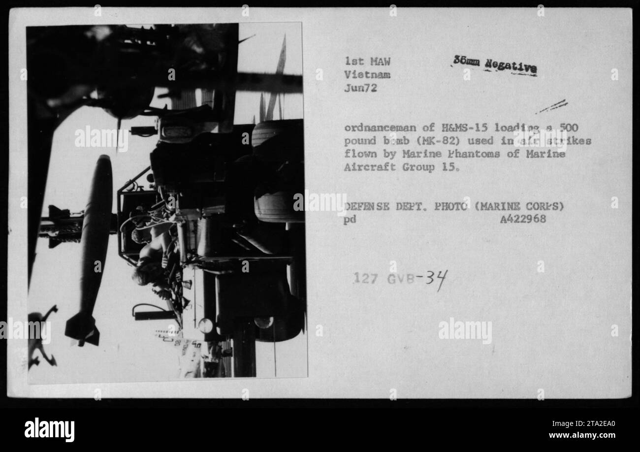 Ordnanceman from H&MS-15 loading a 500-pound MK-82 bomb onto a Marine ...