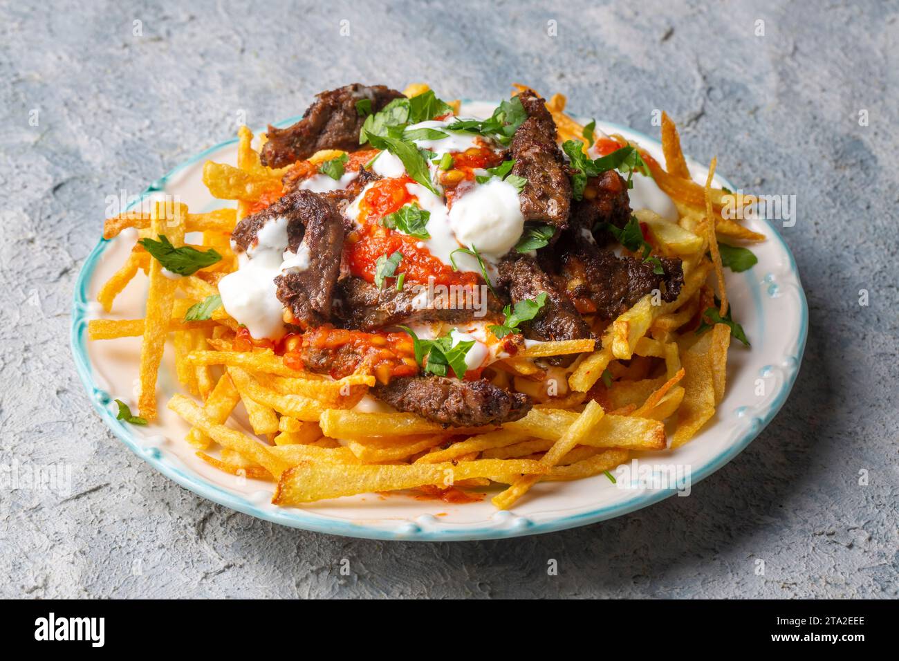 Turkish food; Cokertme Kebab - Beef meat kebab with yoghurt and french ...