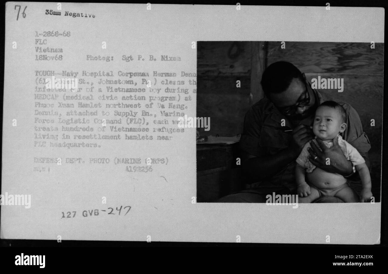 Caption: Navy Hospital Corpsman Herman Dena from Johnstown, PA, cleans ...