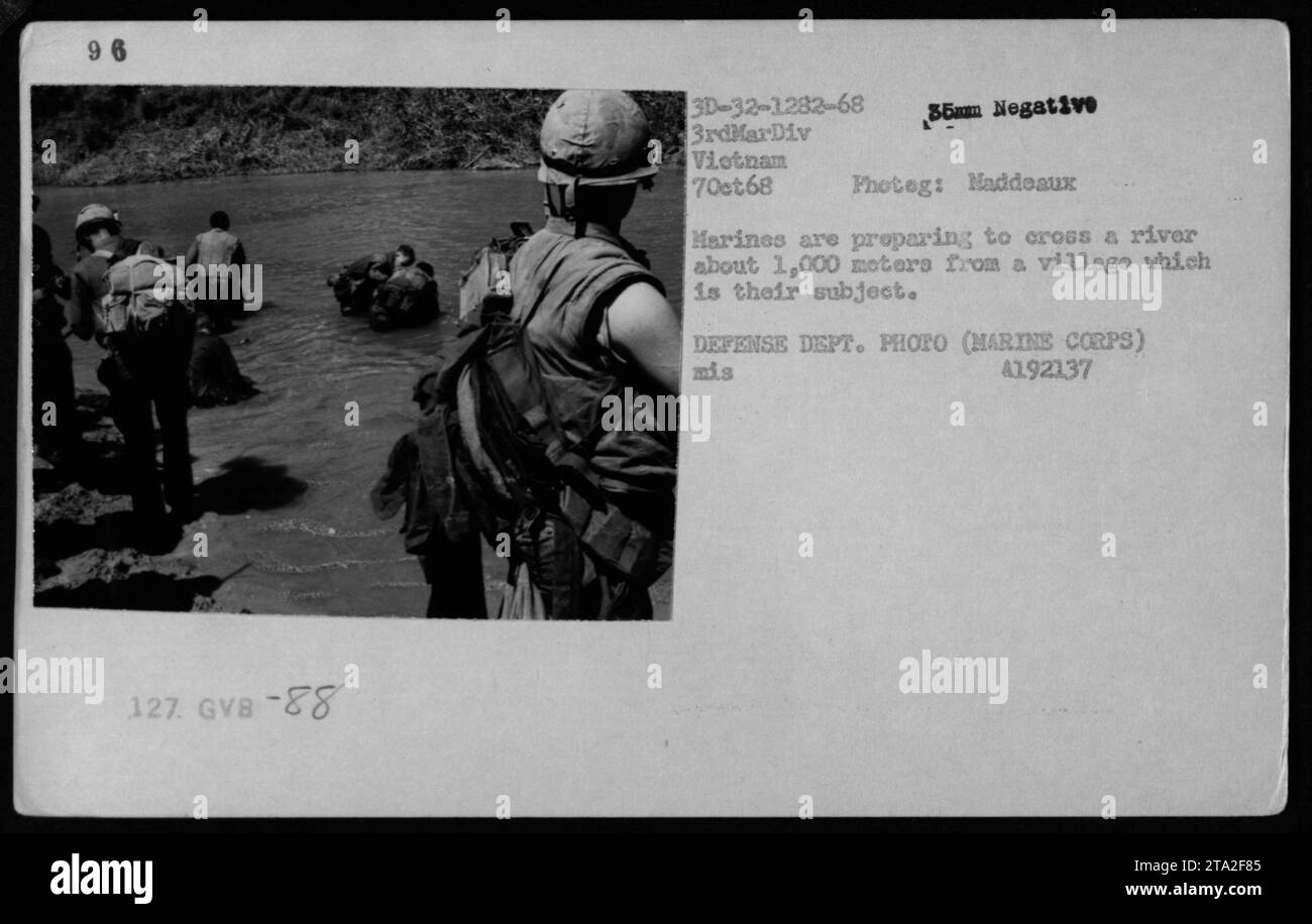 Marines prepare to traverse a river approximately 1,000 meters away ...