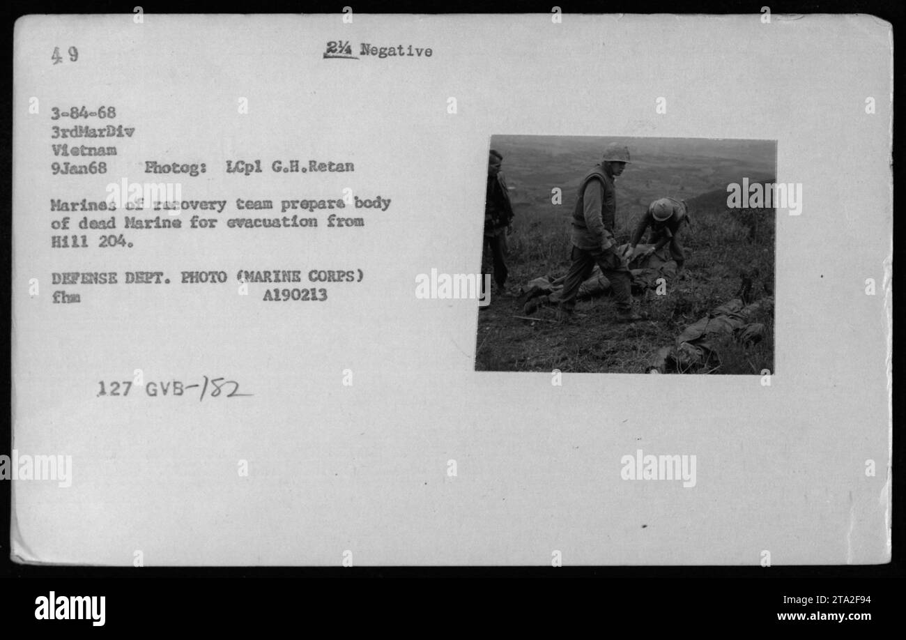 Marines of recovery team preparing the body of a dead Marine for ...