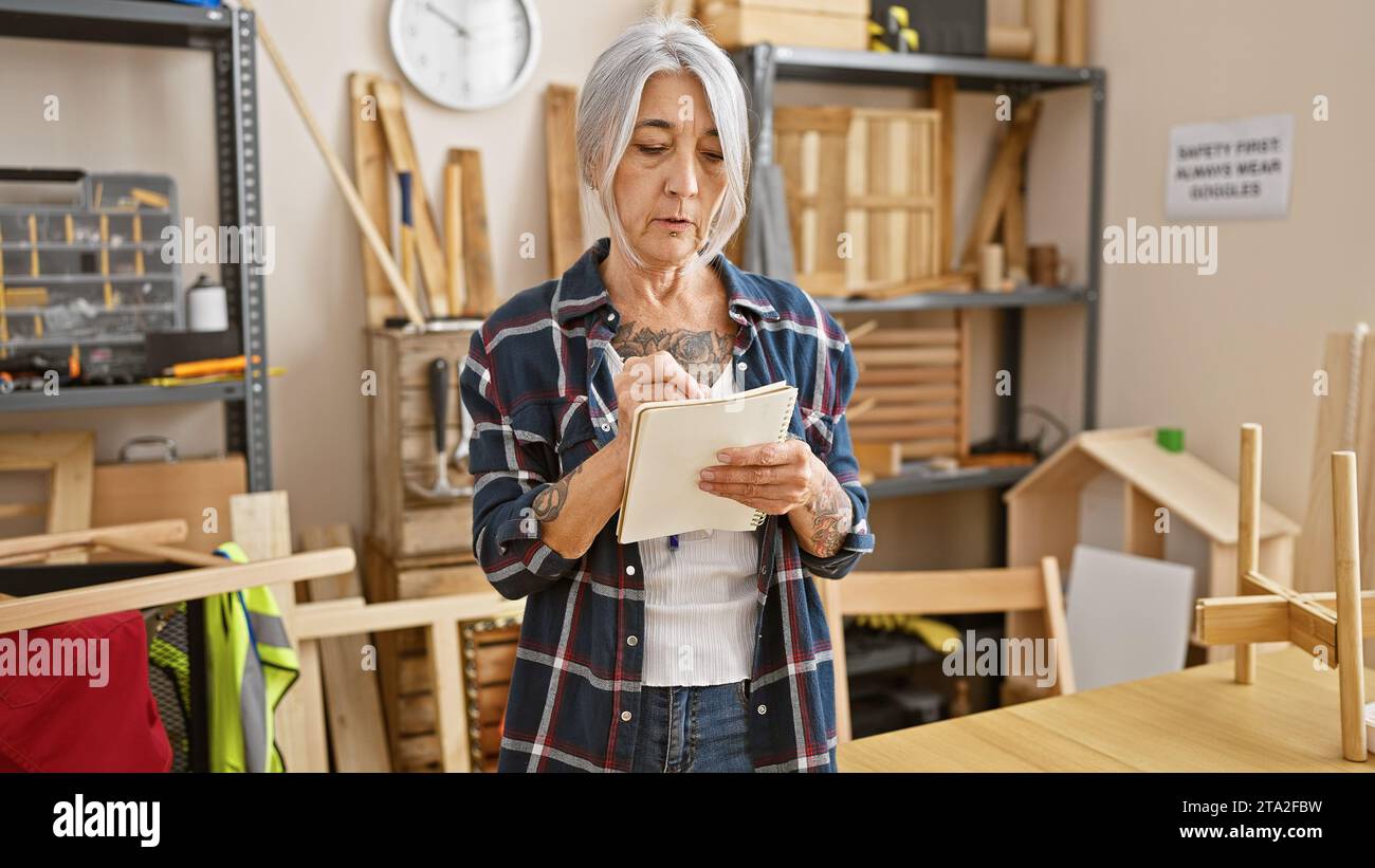 Female carpenter taking notes hi-res stock photography and images - Alamy