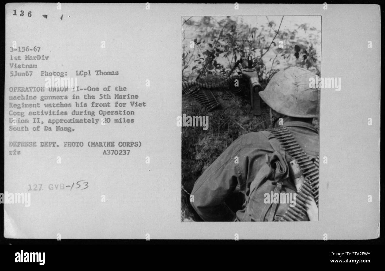 A machine gunner from the 5th Marine Regiment maintains vigilance for ...