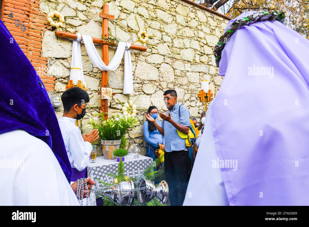 Churchgoers pray in front of neighbourhood altars during the Good ...