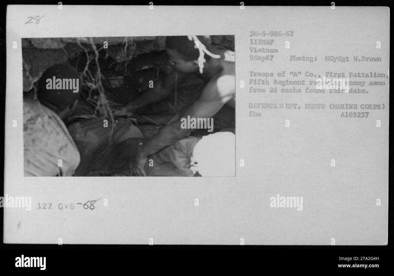 Troops from A Company, First Battalion, Fifth Regiment remove enemy ...